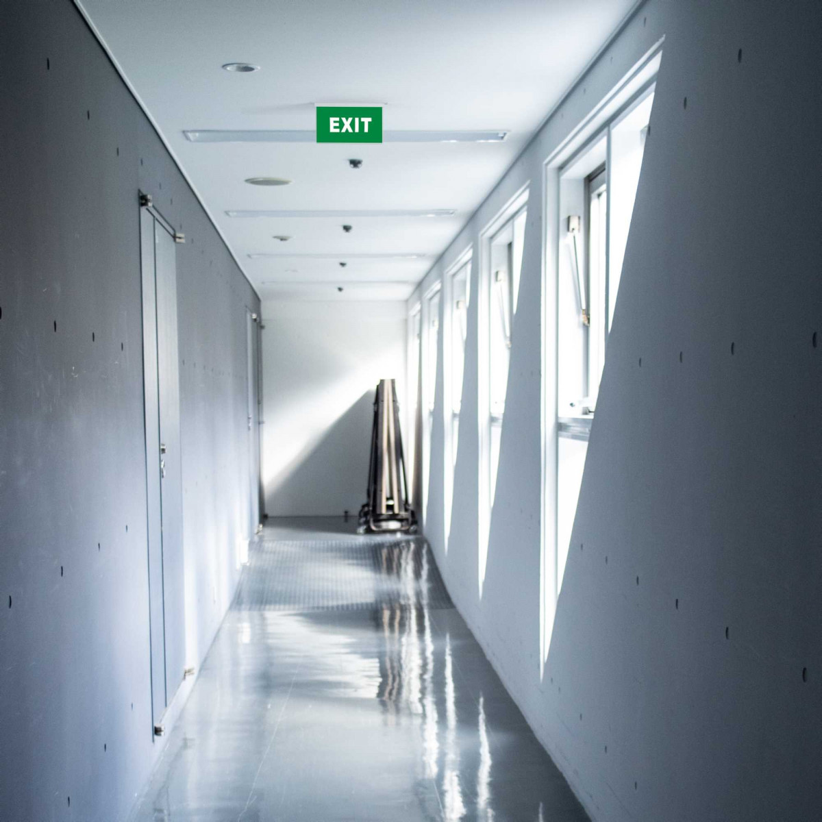 Recessed permanent emergency light with "EXIT" sign